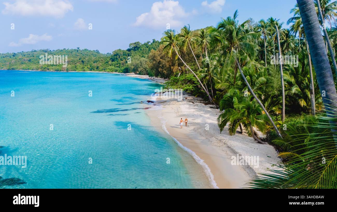 Explore the breathtaking Koh Kood Island in Thailand, featuring soft sandy beaches, palm trees ...