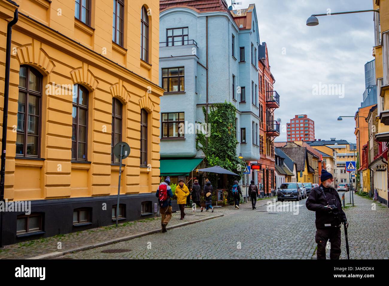 People waling on street in colorful Gamla Vaster, Malmo, Sweden Stock ...