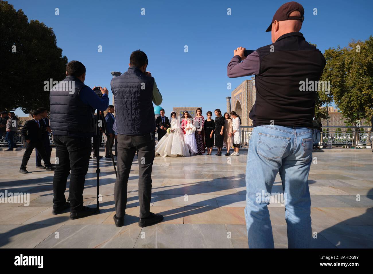 A typical family, posing for pictures, photos with a wedding bride ...