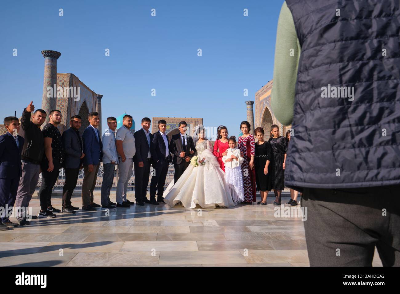 A typical family, posing for pictures, photos with a wedding bride ...