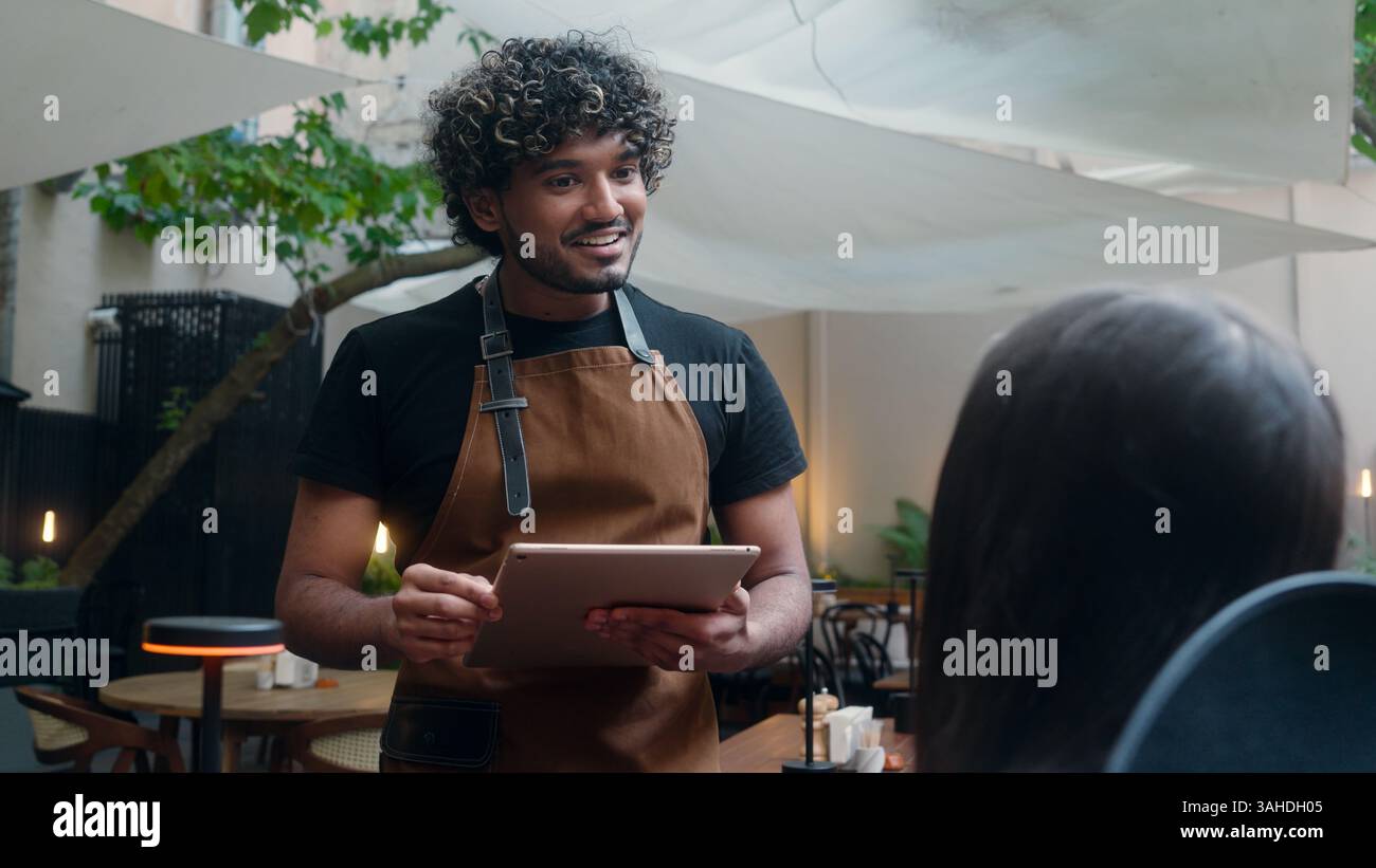 Smiling Indian man Arabian latino guy friendly cafe worker barista in ...