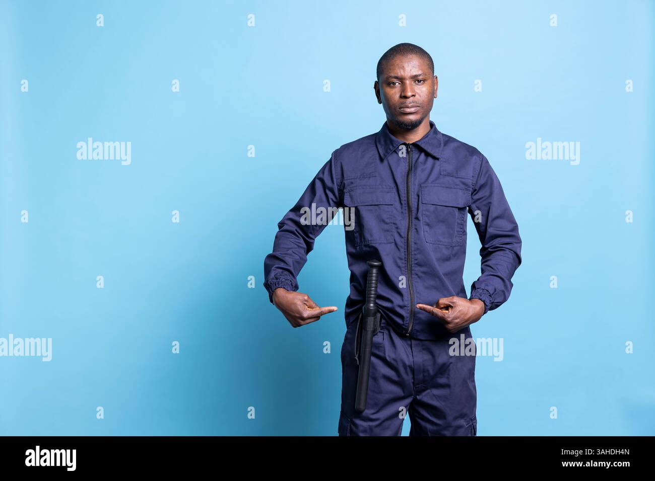 Armed security officer presenting his baton weapon for own safety in ...