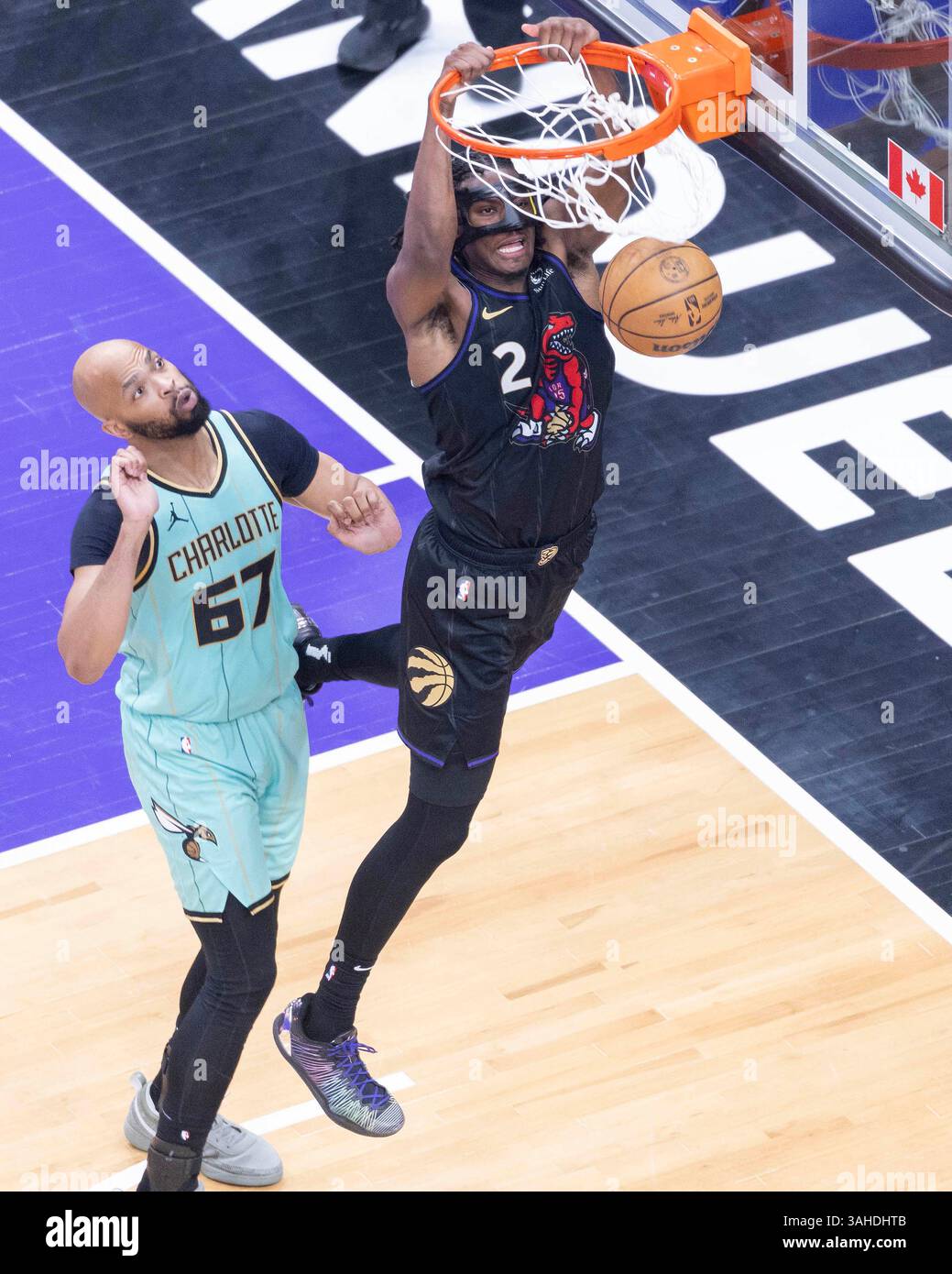 Toronto, Canada. 9th Apr, 2025. Jonathan Mogbo (R) of Toronto Raptors dunks during the 2024-2025 ...