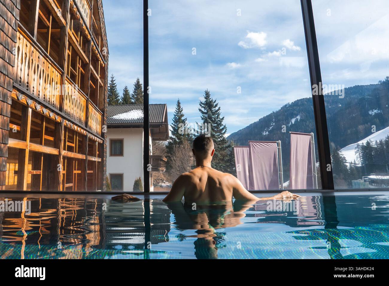 Indoor Infinity Pool Overlooking Snow Covered Italian Alps Stock Photo ...