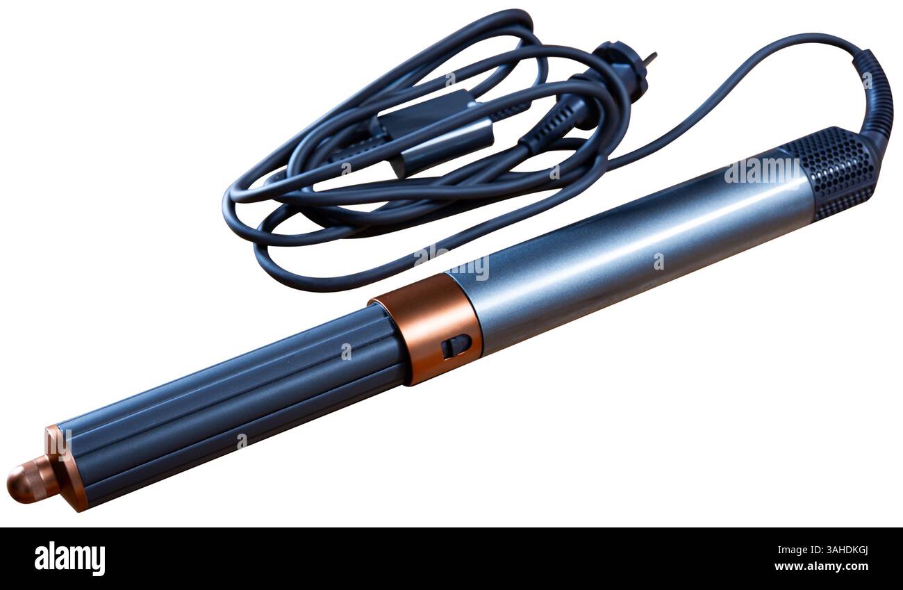 Hair styling tool for creating curls on wooden table Stock Photo - Alamy