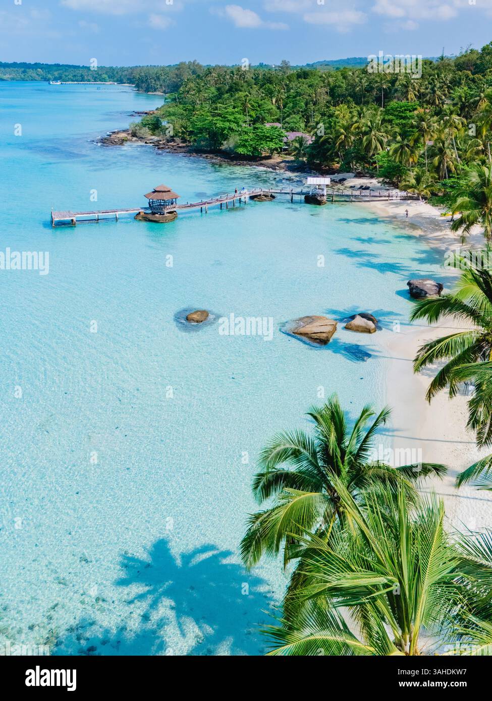 This stunning aerial view of Koh Kood Island in Thailand highlights its turquoise waters, sandy ...