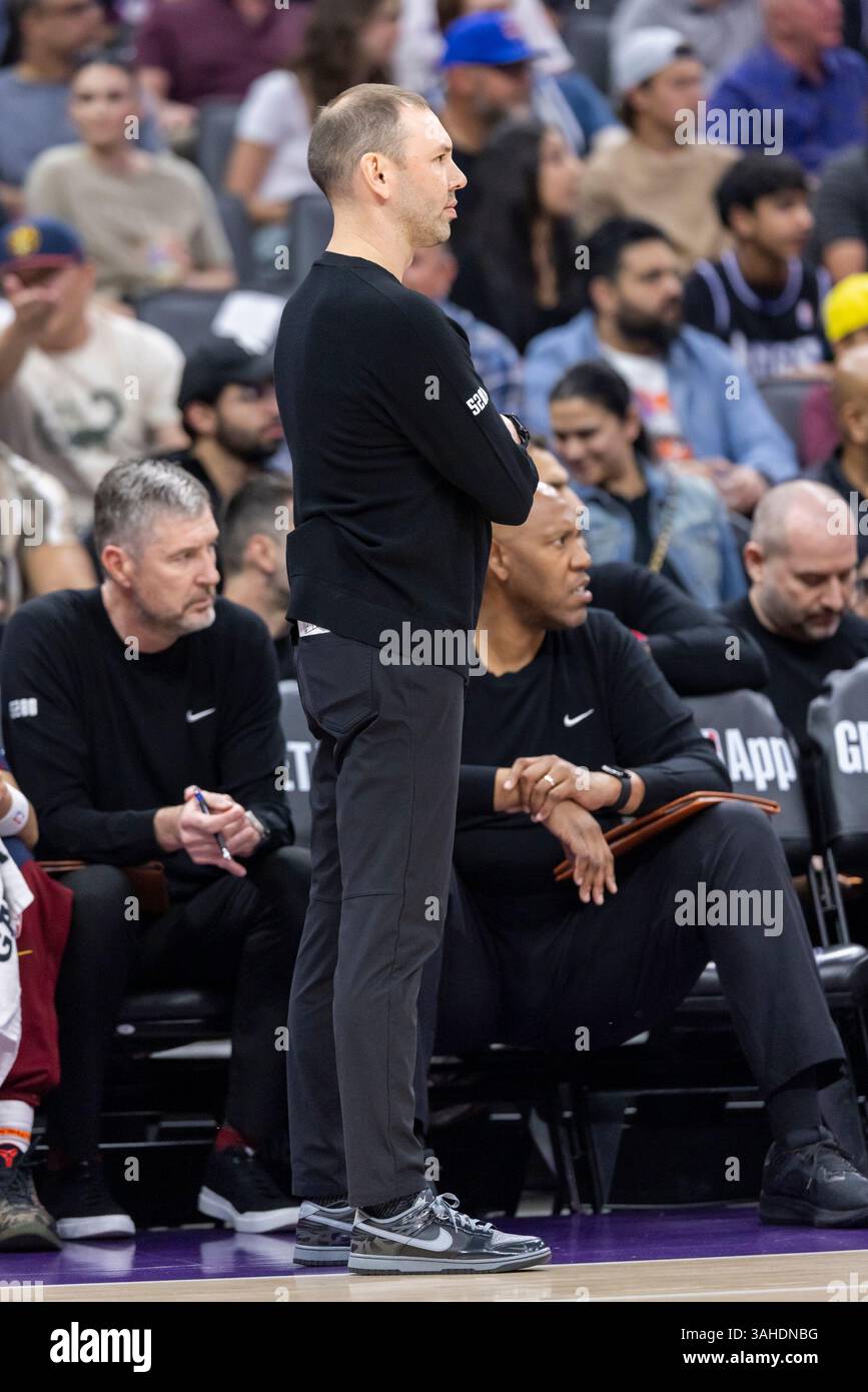 Denver Nuggets Head Coach David Adelman watches the team on defense ...