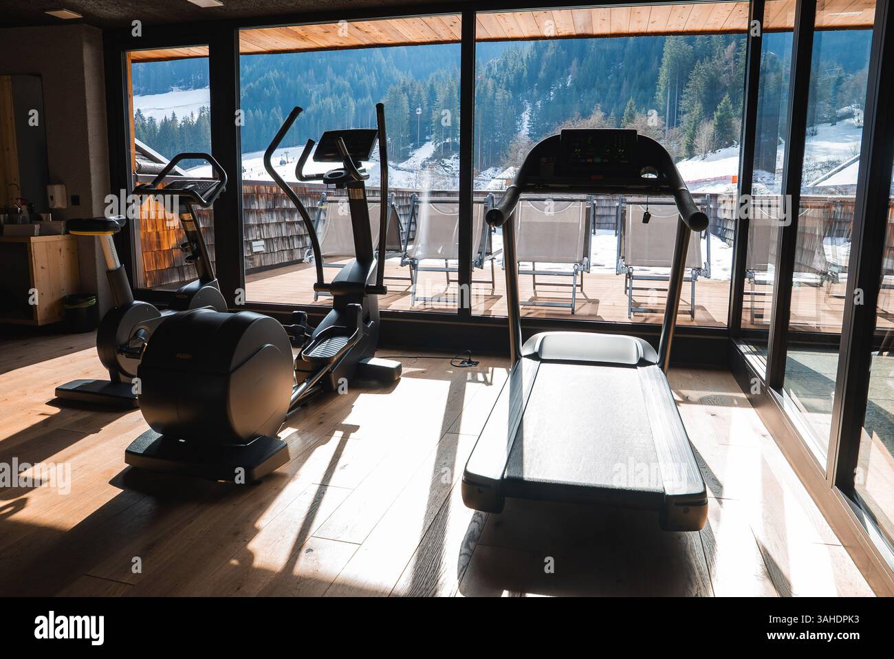 Modern Gym with Glass Windows Overlooking Italian Alpine Landscape ...