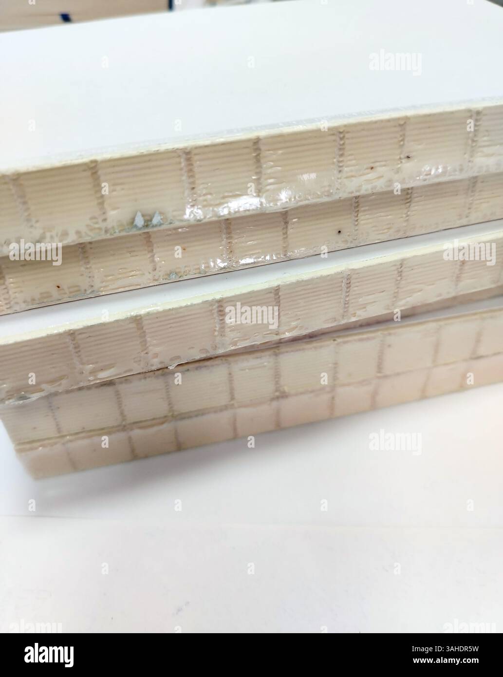 Close-up, a stack of glued book blocks prepared for binding in a ...