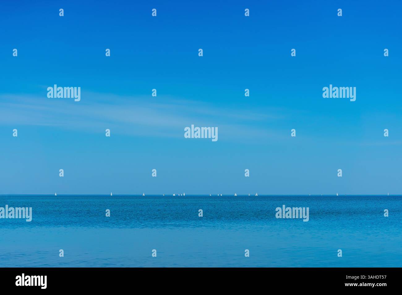 sailing training on lake kapchagay. boats with white sails on the ...