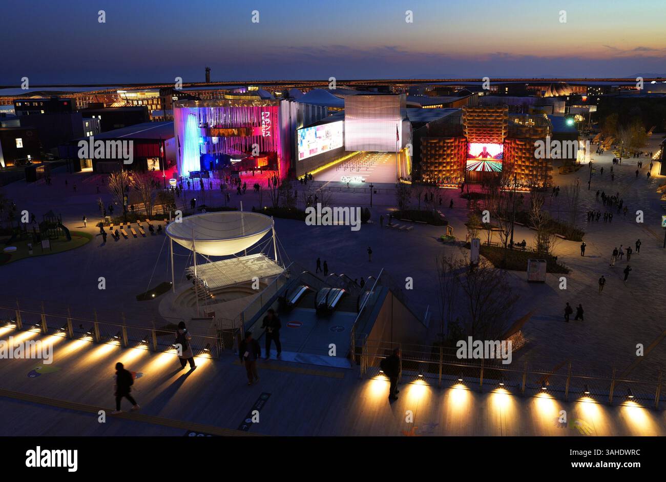 Pavilions for the 2025 World Exposition in Osaka are lit up as the ...