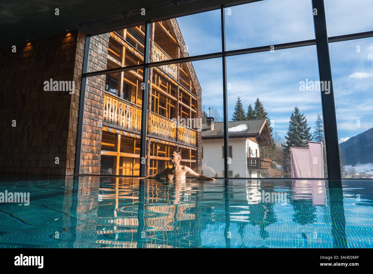 Indoor Pool with Floor to Ceiling Windows Overlooking Italian Alps ...