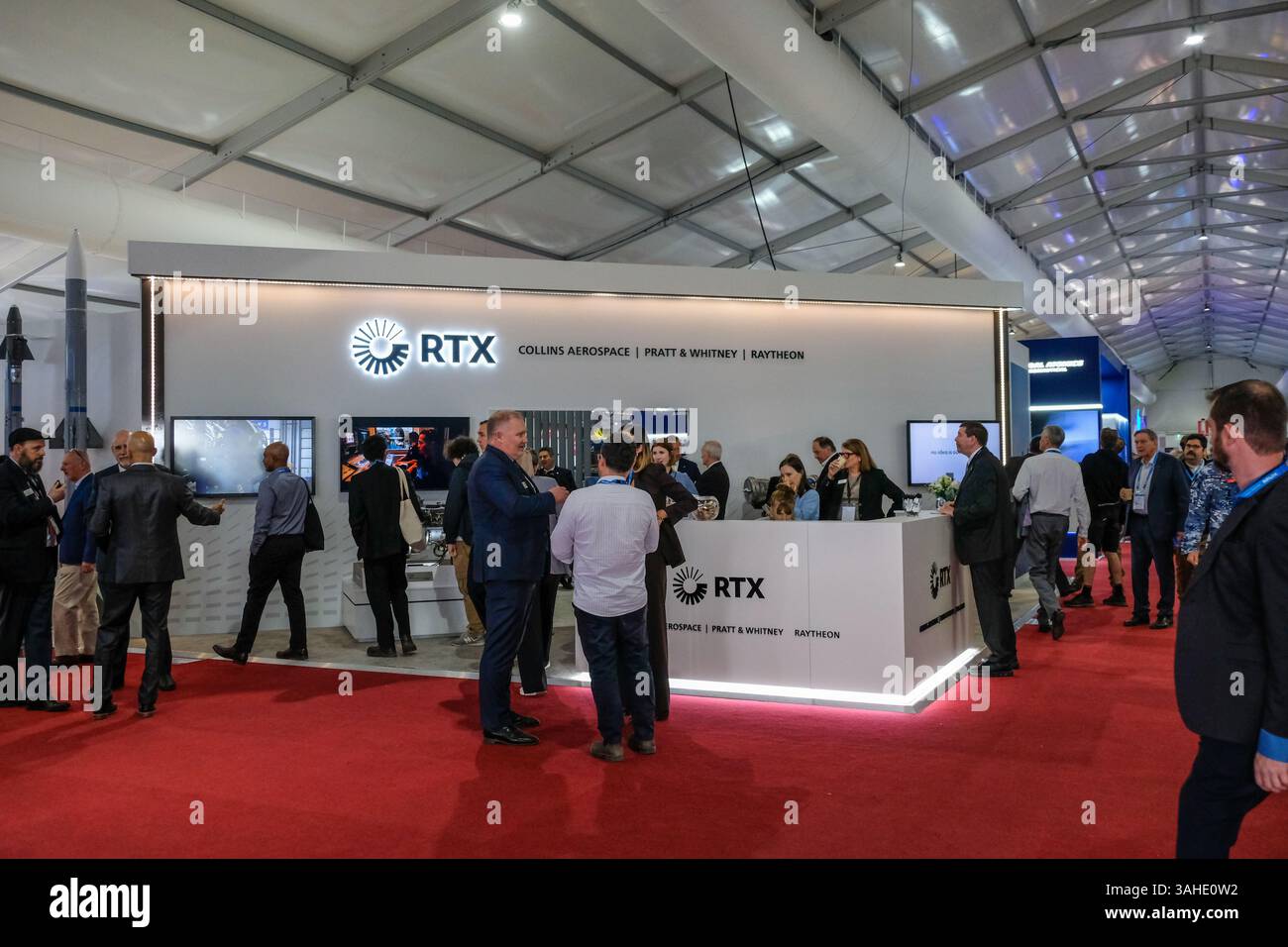 A stand with logo of RTX Corporation formerly Raytheon Technologies ...