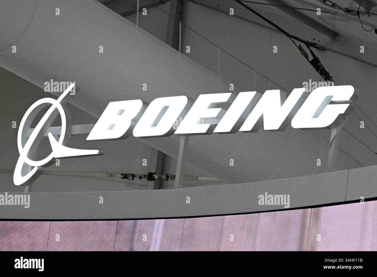 In this photo illustration, logo of Boeing an American civil and ...