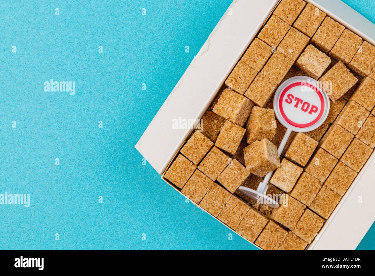 A box filled with brown sugar cubes neatly organized, featuring a ...