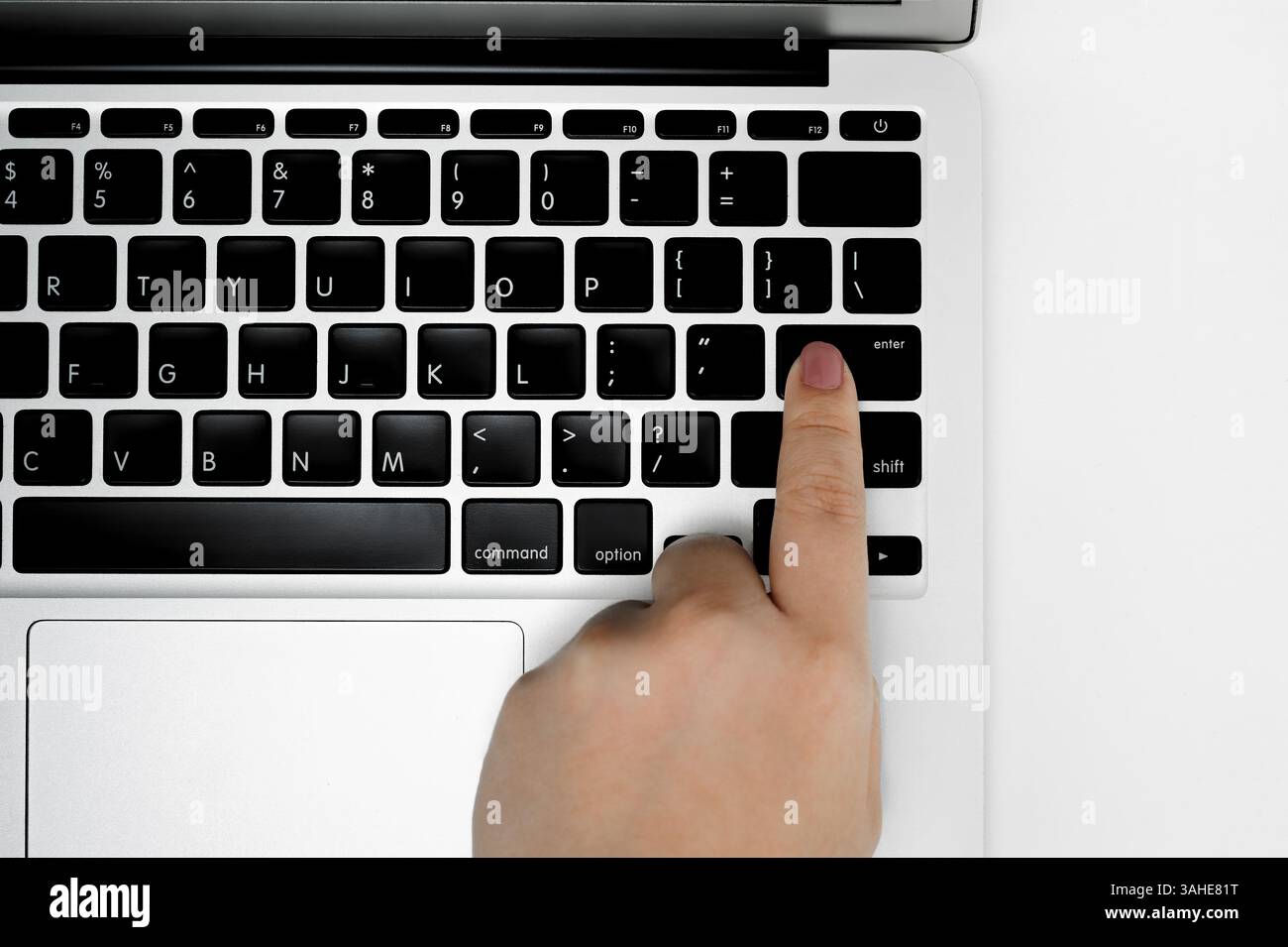 a hand with Index finger touch on computer keyboard's blank black color ...