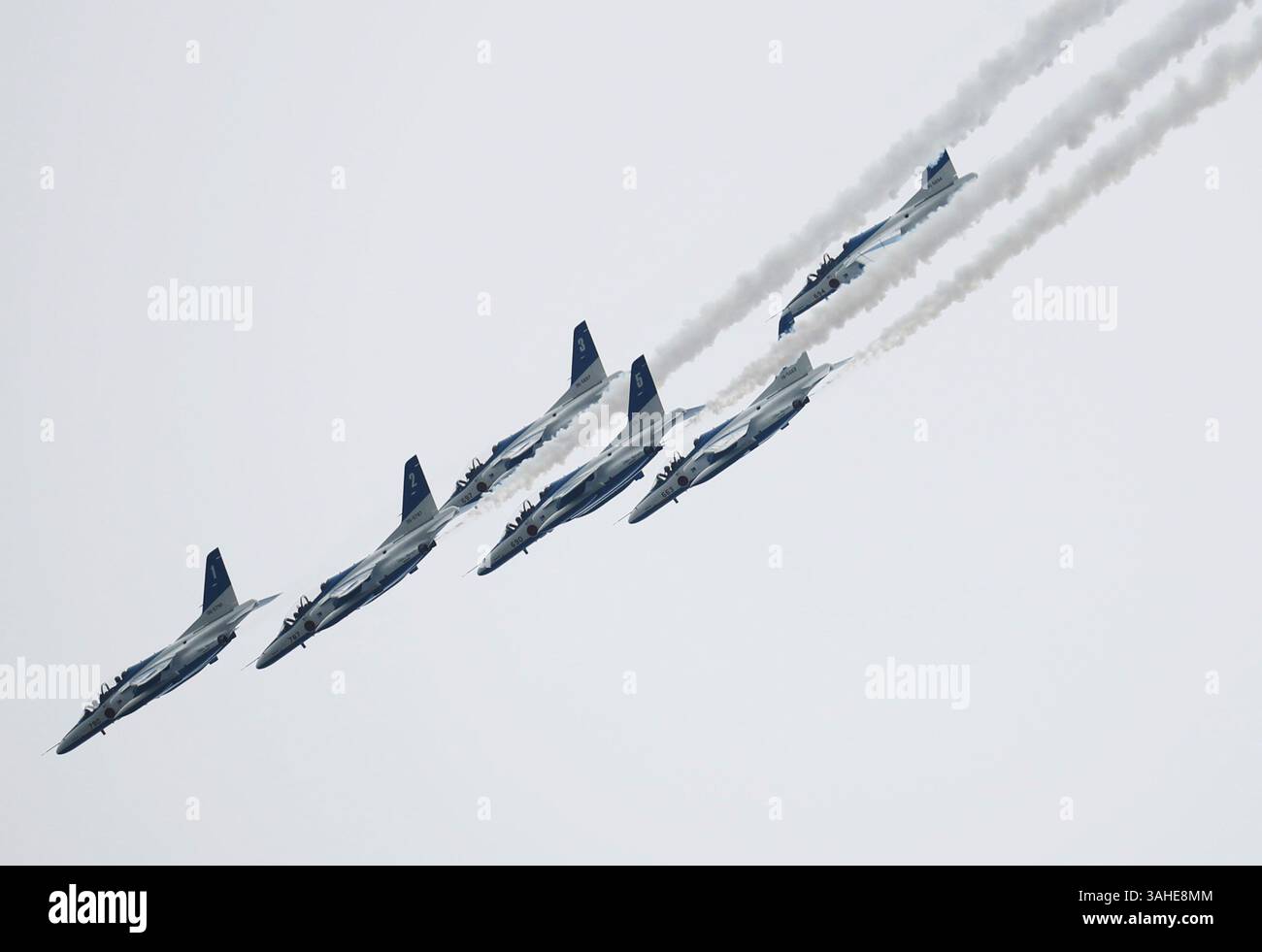 Six Blue Impulses aircraft of the Japan Air Self-Defense Force fly over ...