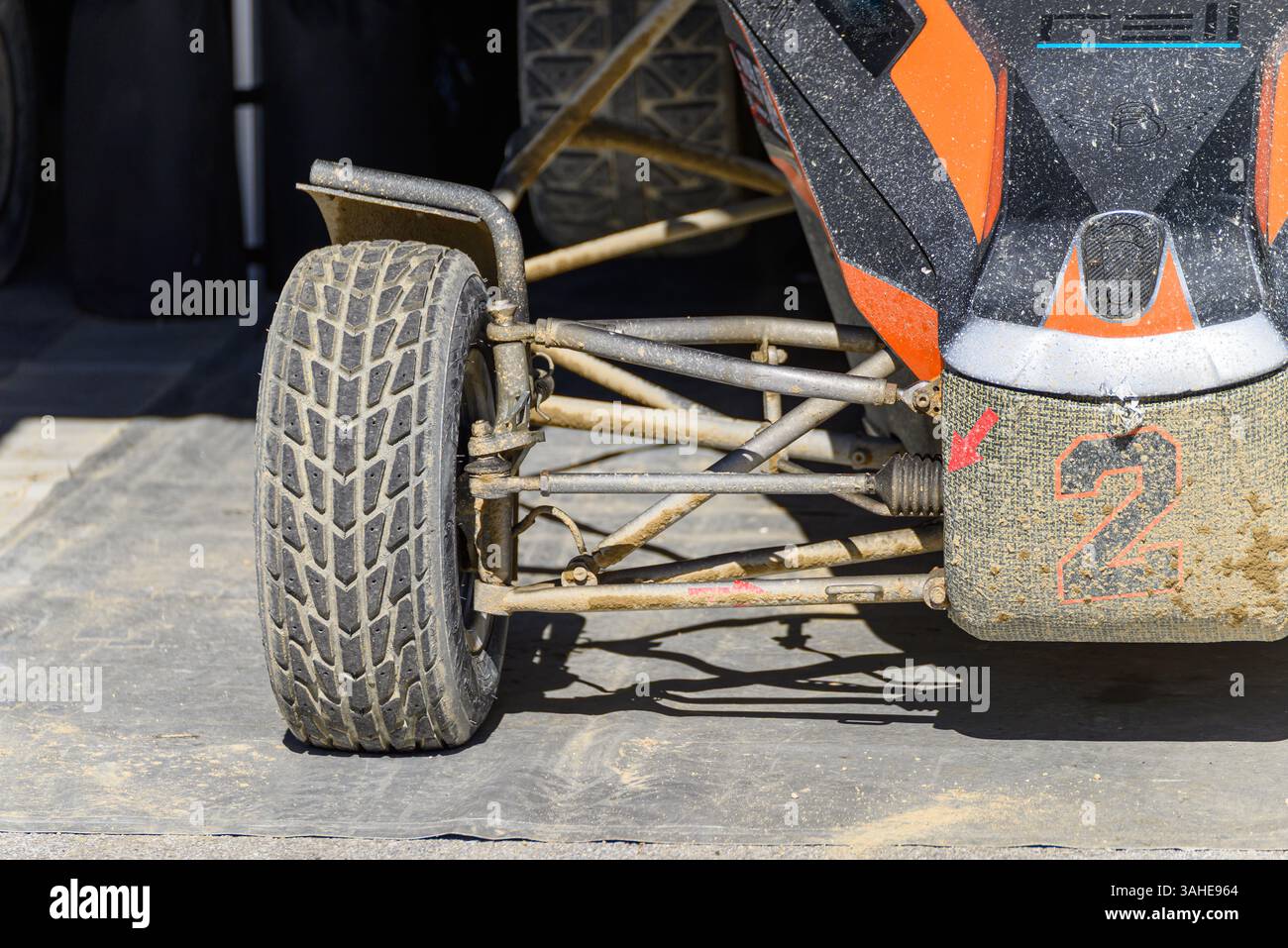 off road buggy wheel and suspension close up after a competition after ...