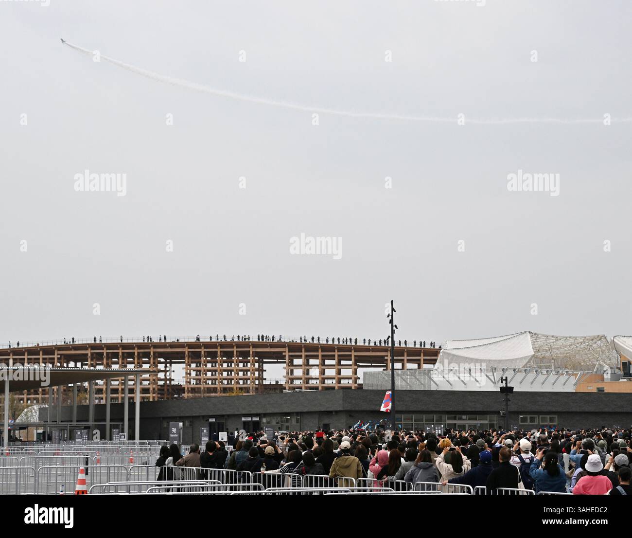 Six Blue Impulses aircraft of the Japan Air Self-Defense Force fly over ...