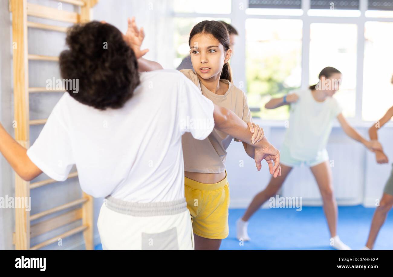 Boy and girl practicing self-defense techniques Stock Photo - Alamy