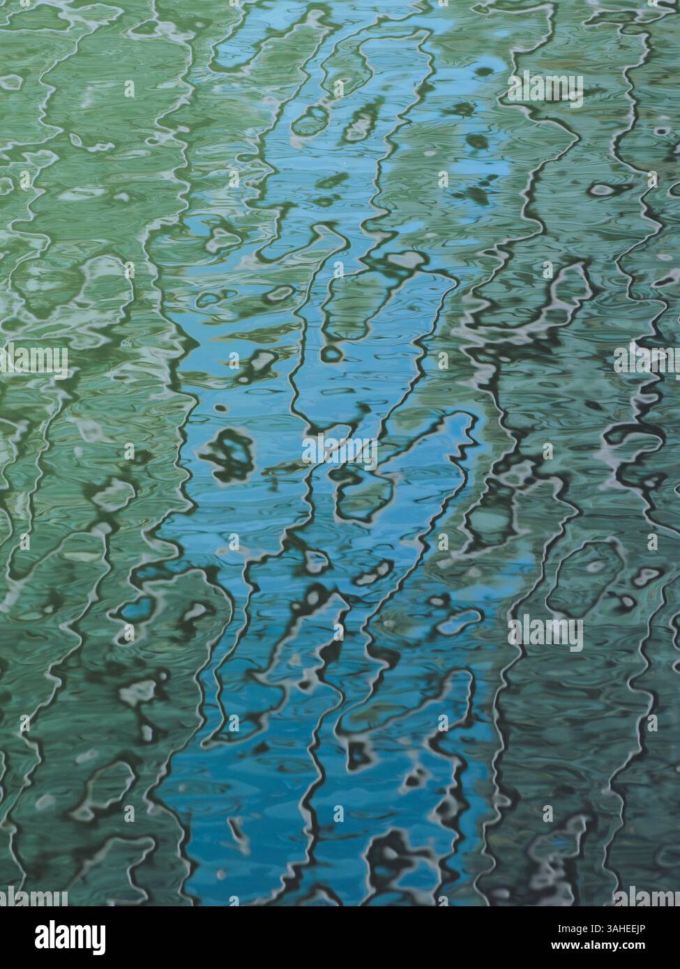 Rippled abstract patterns of buildings in water Stock Photo - Alamy