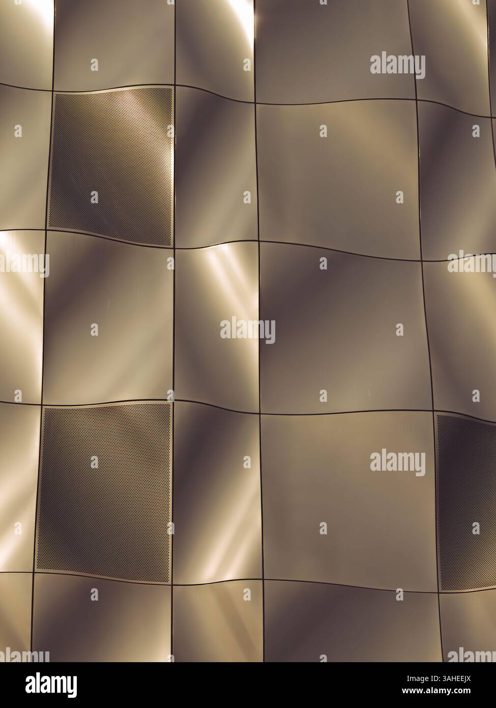 Reflective wavy building cladding giving a water reflection effect ...