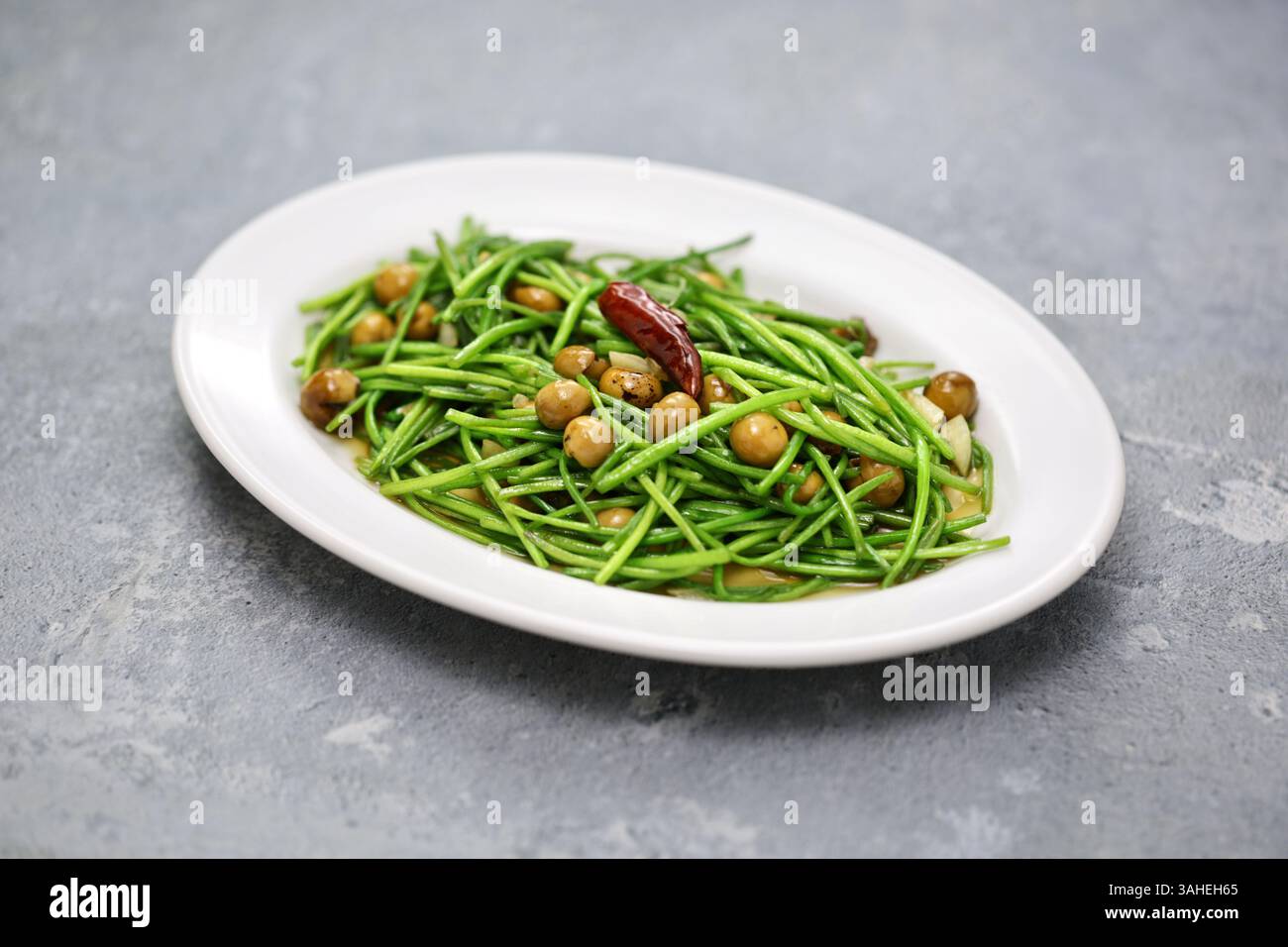 stir-fried white water snowflake stems with pickled cordia dichotoma ...