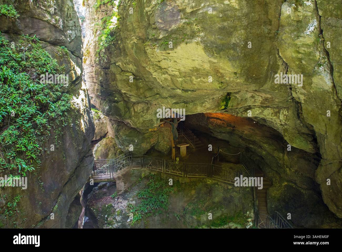 A walkway and cave in the Cosa Torrente canyon at the Grotte di Pradis ...