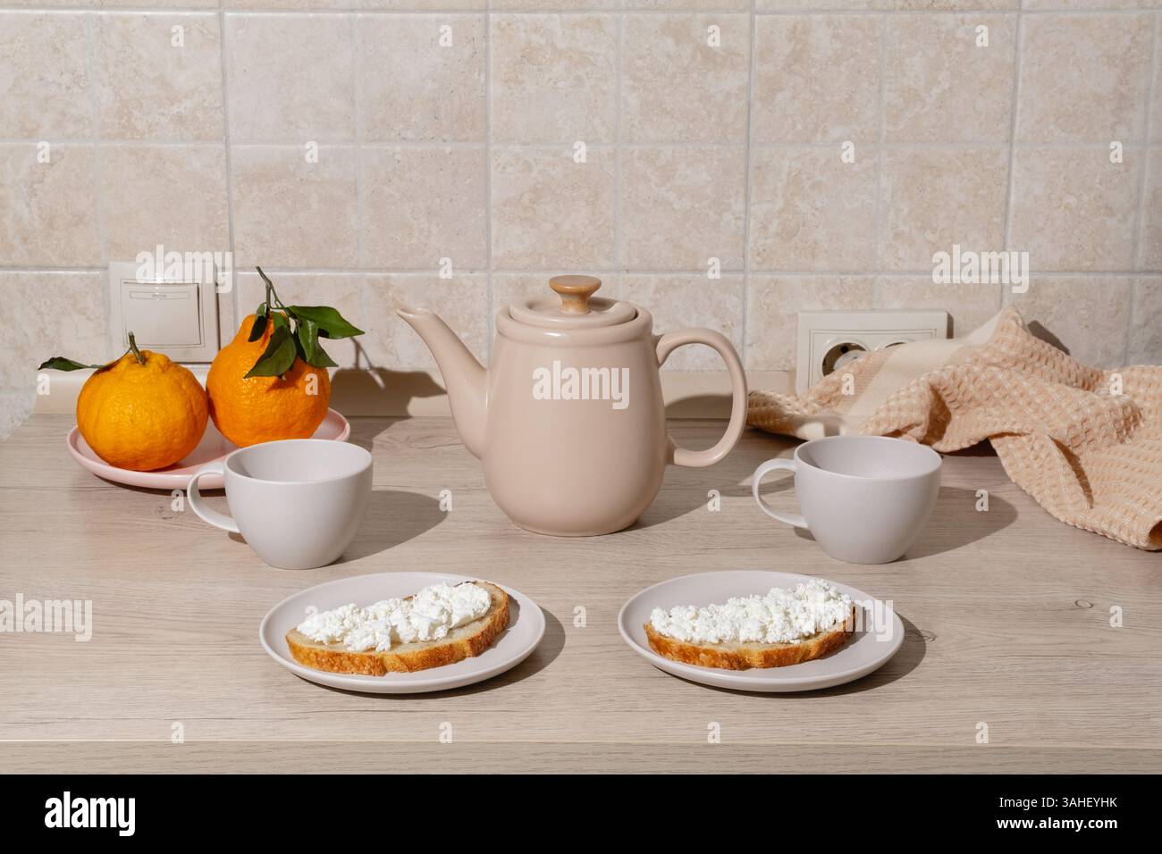 Breakfast scene featuring two plates wiCozy Breakfast Setup with Tea ...