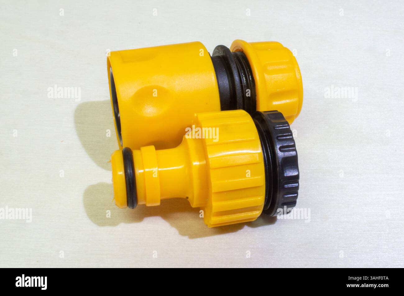 Plastic hose connector Stock Photo - Alamy