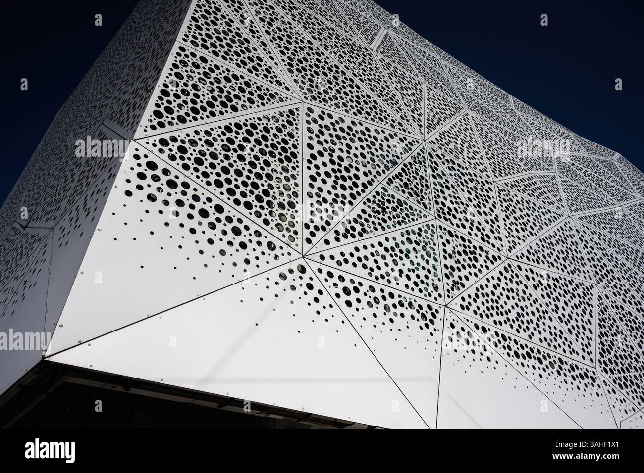 A striking architectural facade featuring intricate geometric designs ...