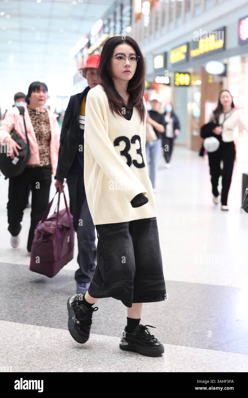 Chinese singer and actress Yu Yan appears at the airport in Beijing ...