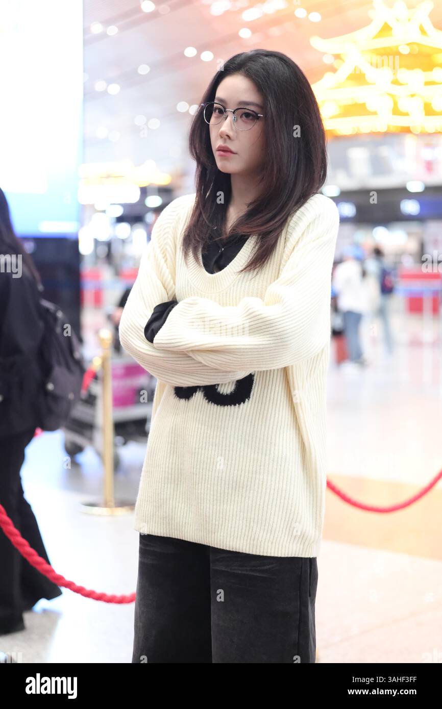 Chinese singer and actress Yu Yan appears at the airport in Beijing ...