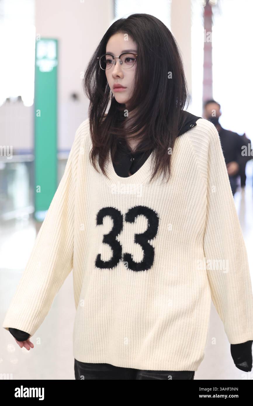 Chinese singer and actress Yu Yan appears at the airport in Beijing ...