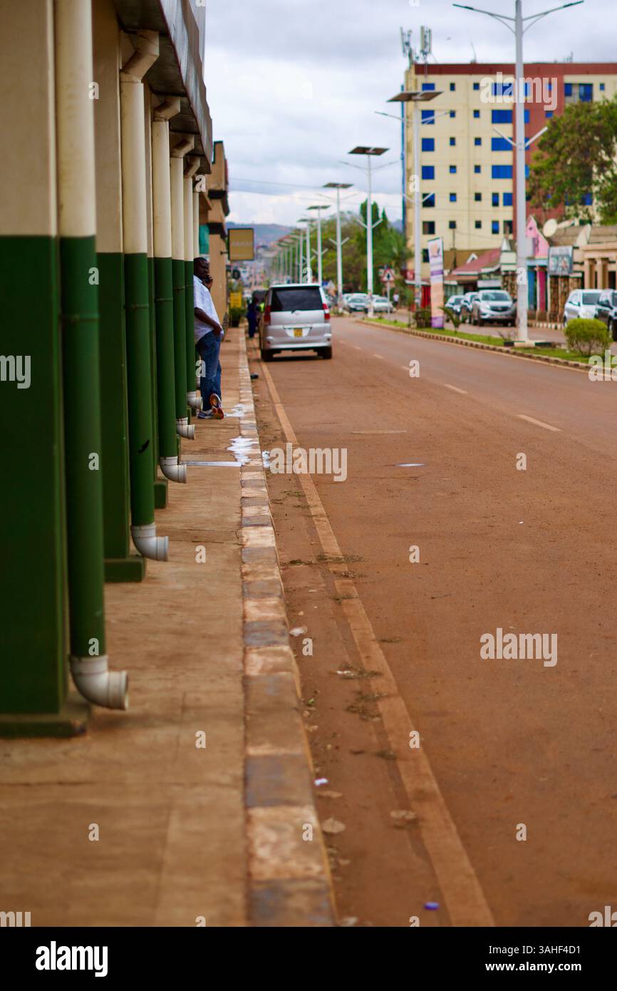 large building in Jinja Africa with car and boda boda Stock Photo - Alamy