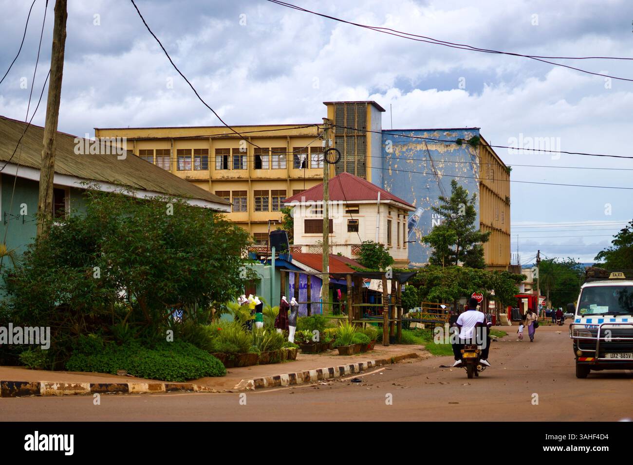 large building in Jinja Africa with car and boda boda Stock Photo - Alamy