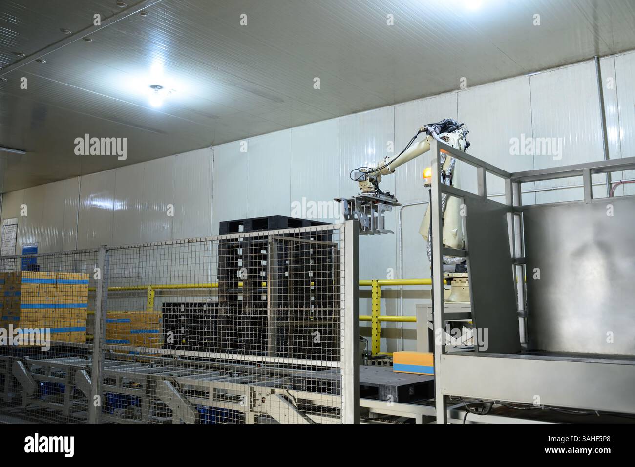Robotic technology in operation at food processing facility, stacking ...