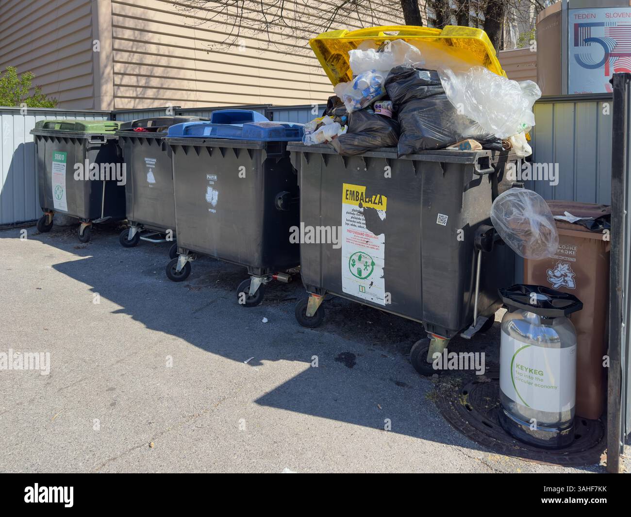 Moste, Ljubljana, SLOVENIA – APRIL 2025: A row of public waste ...