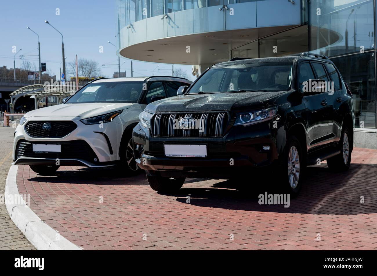 Minsk, Belarus, April 10, 2025 - Two Toyota cars standing near the car ...