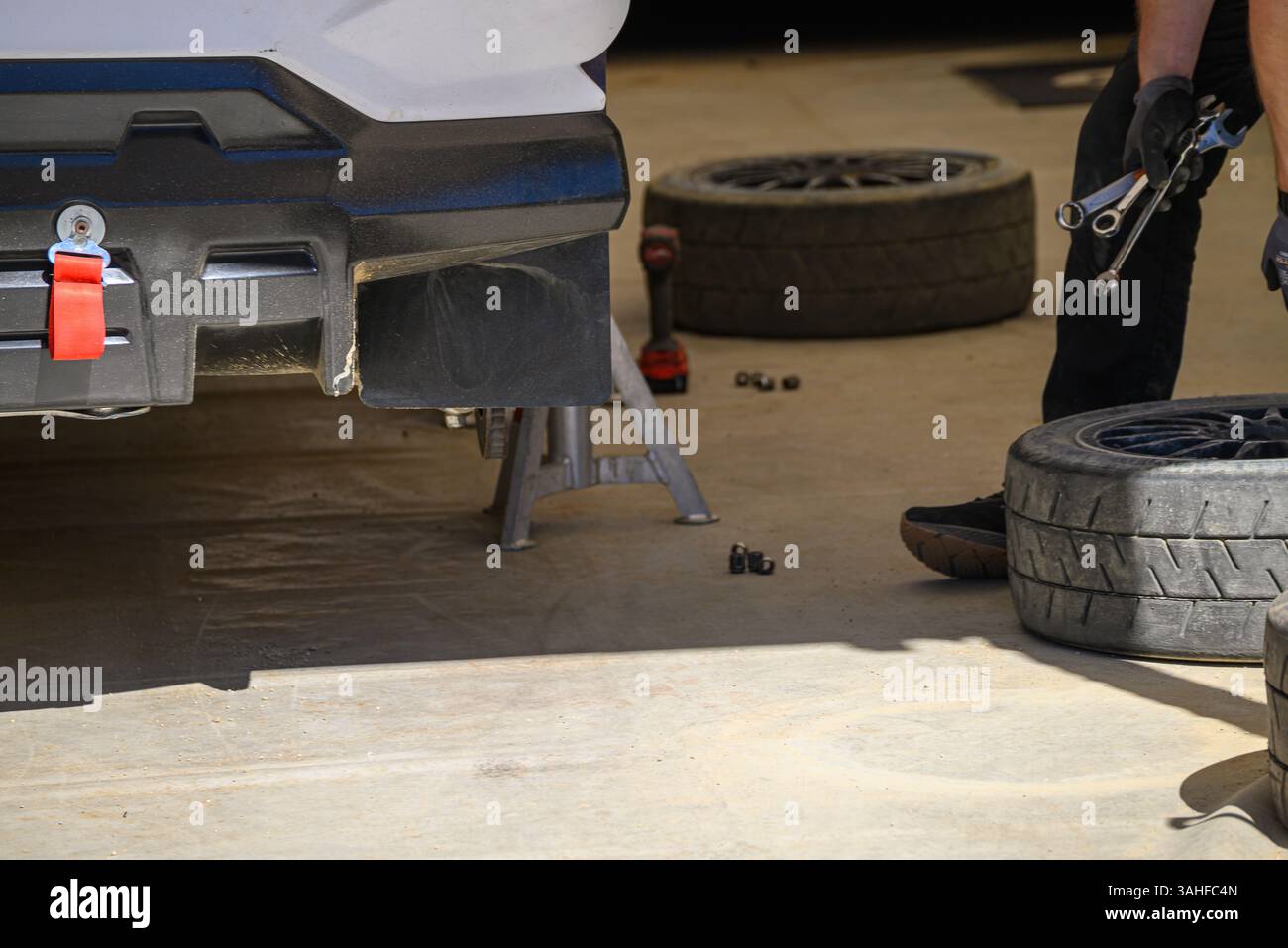 Mechanic working on race car in pit stop,maintenance tools Stock Photo ...