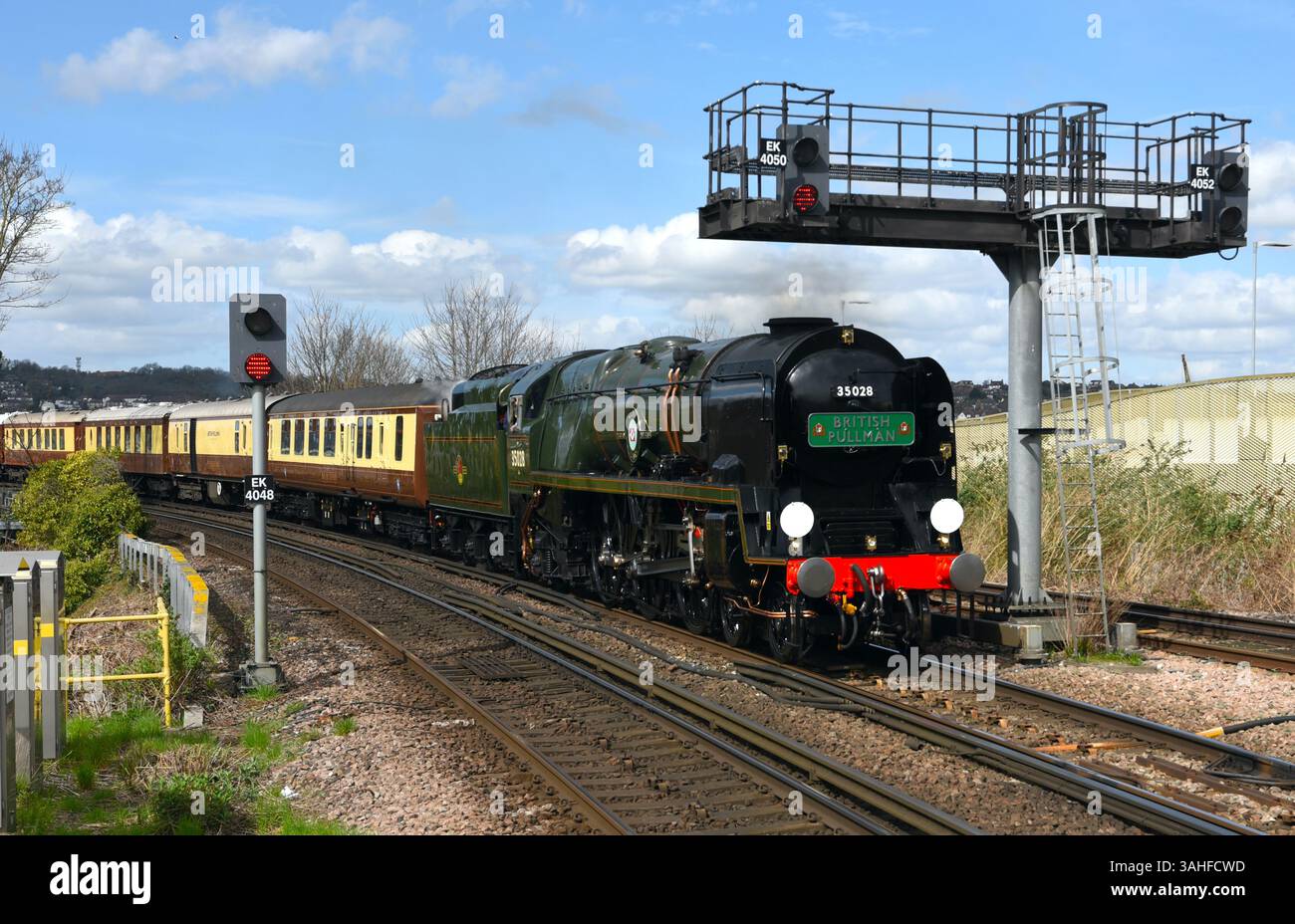 Steam Locomotive British Pullman in the spring sunshine passing through ...
