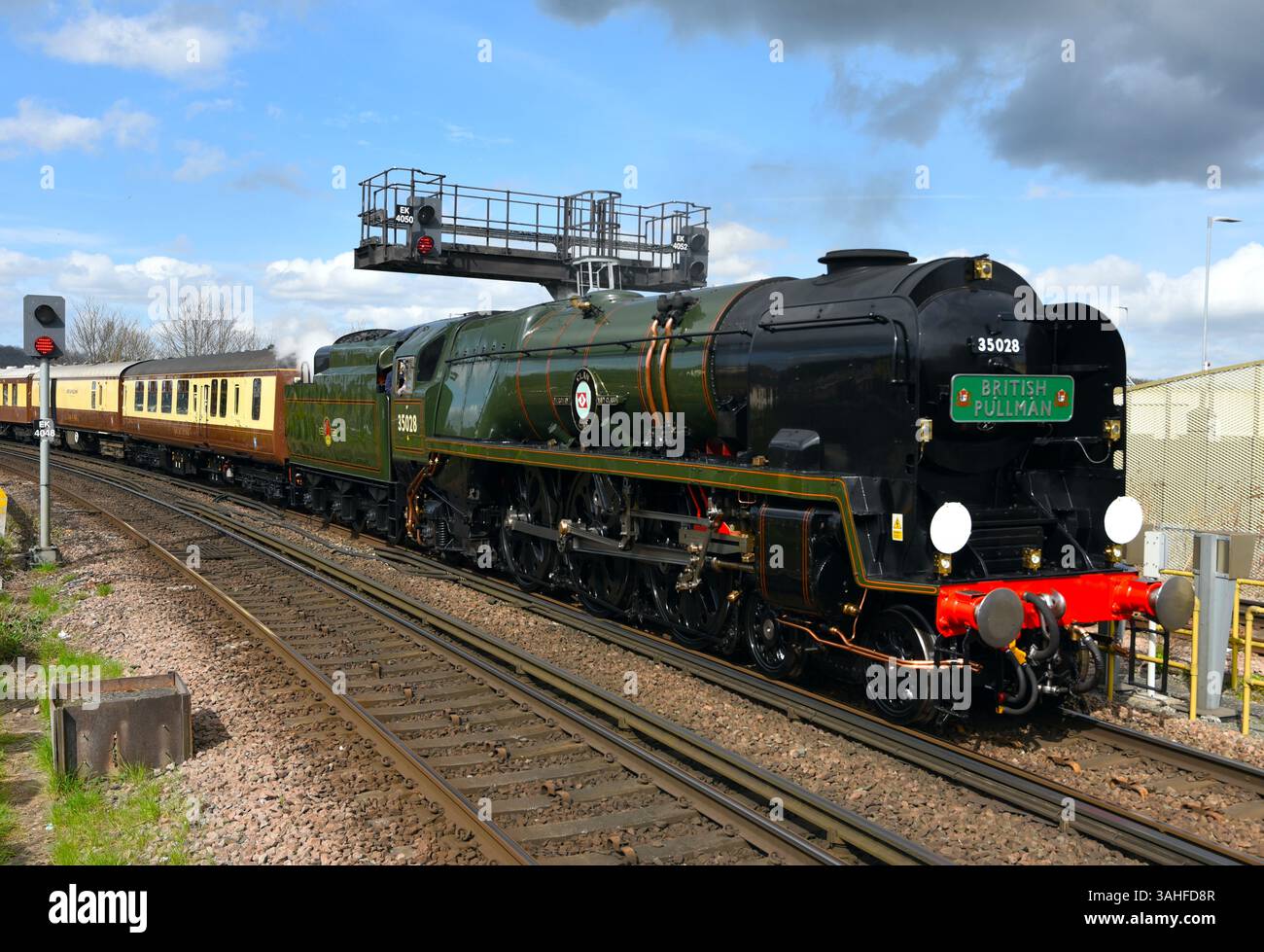 Steam Locomotive British Pullman in the spring sunshine passing through ...