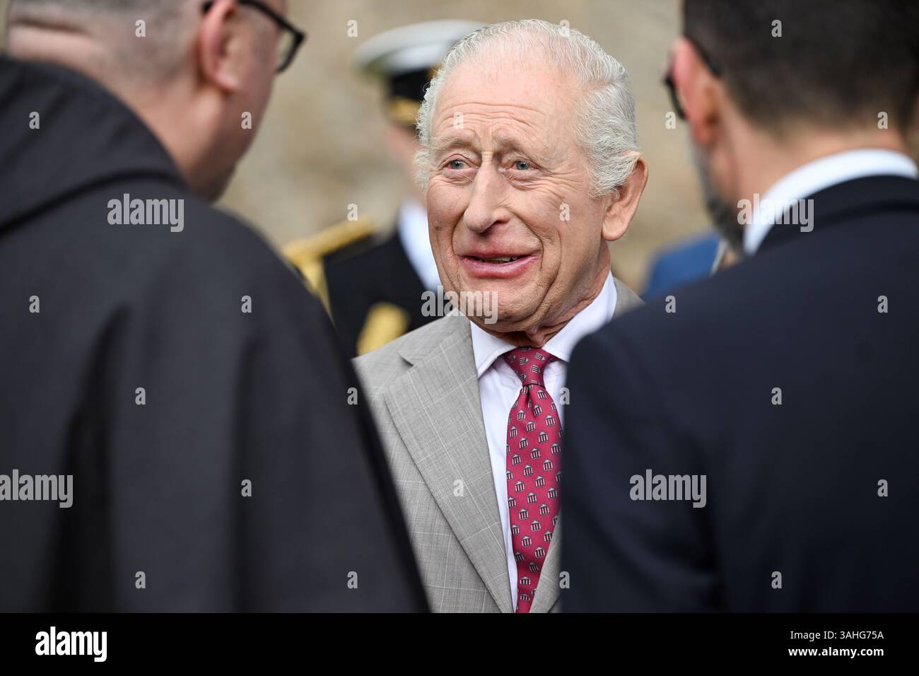 King Charles III unveils a plaquue after planting a tree donated by ...
