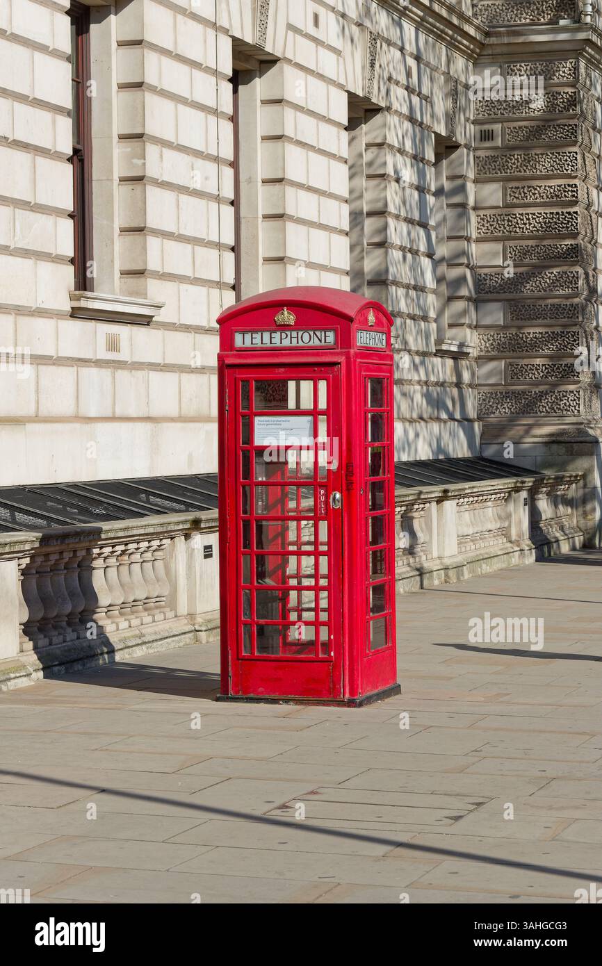 Traditional red painted telephone box in Whitehall central London ...