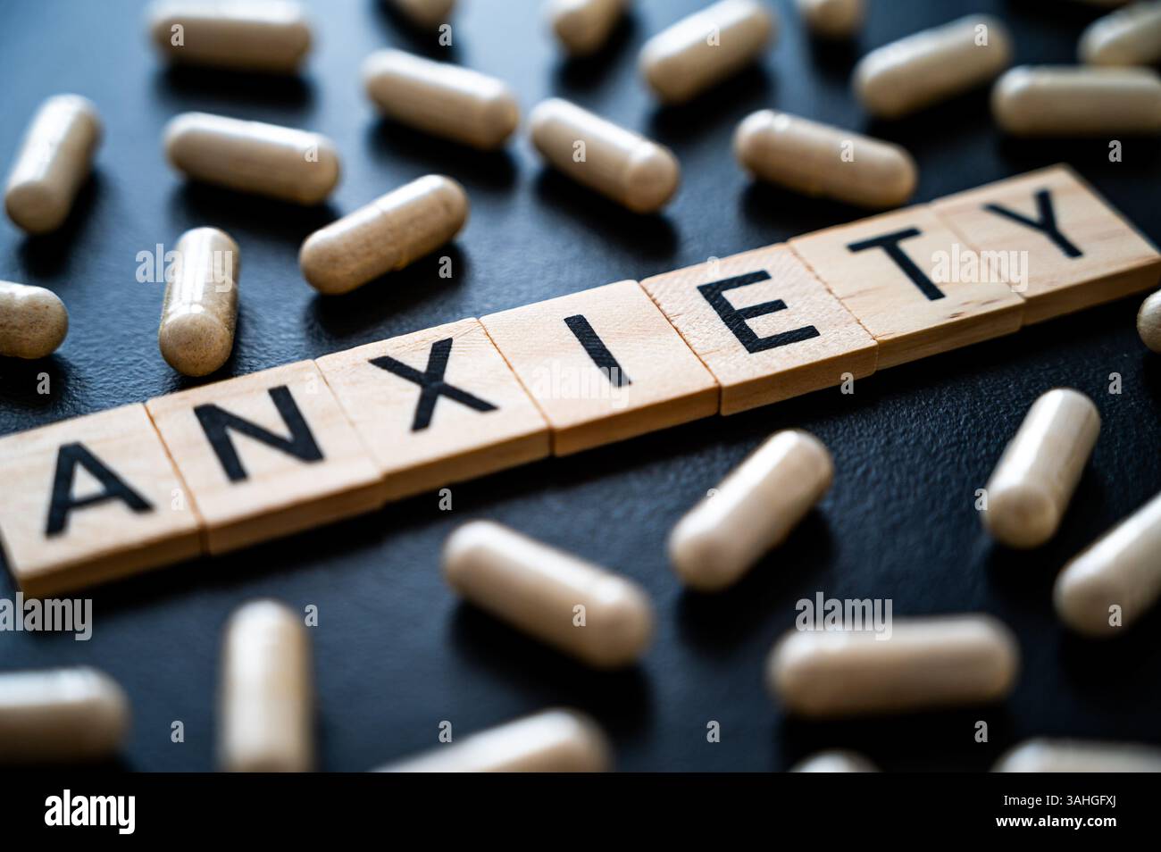 Word Anxiety composed with wooden alphabet on a black background, and ...