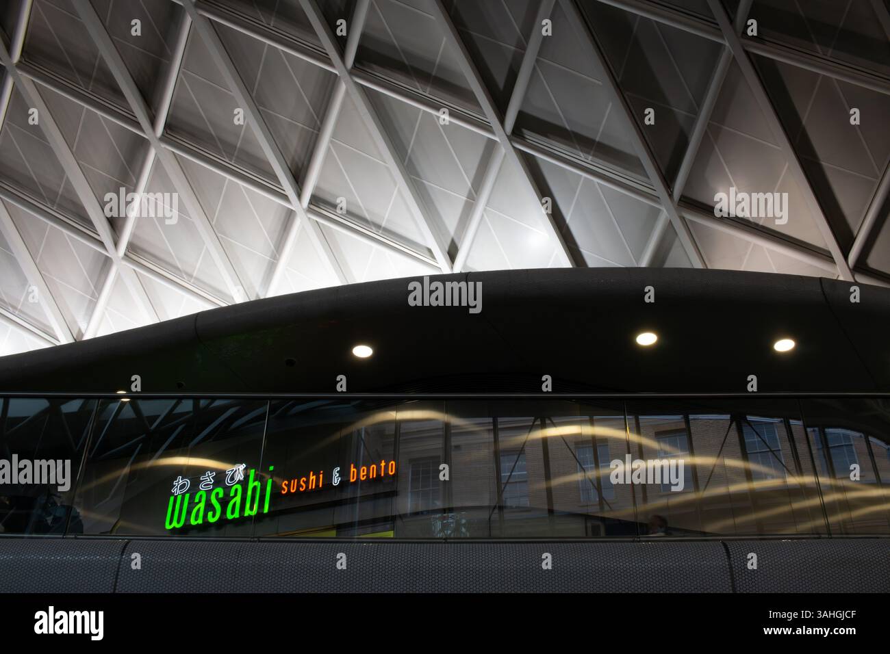 The metal lattice roof and sign for the Wasabi fast food restaurant in ...