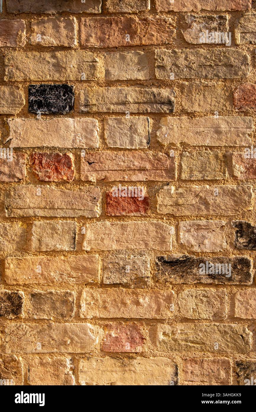 Details of a gault brick wall. The bricks are a selection of yellow ...