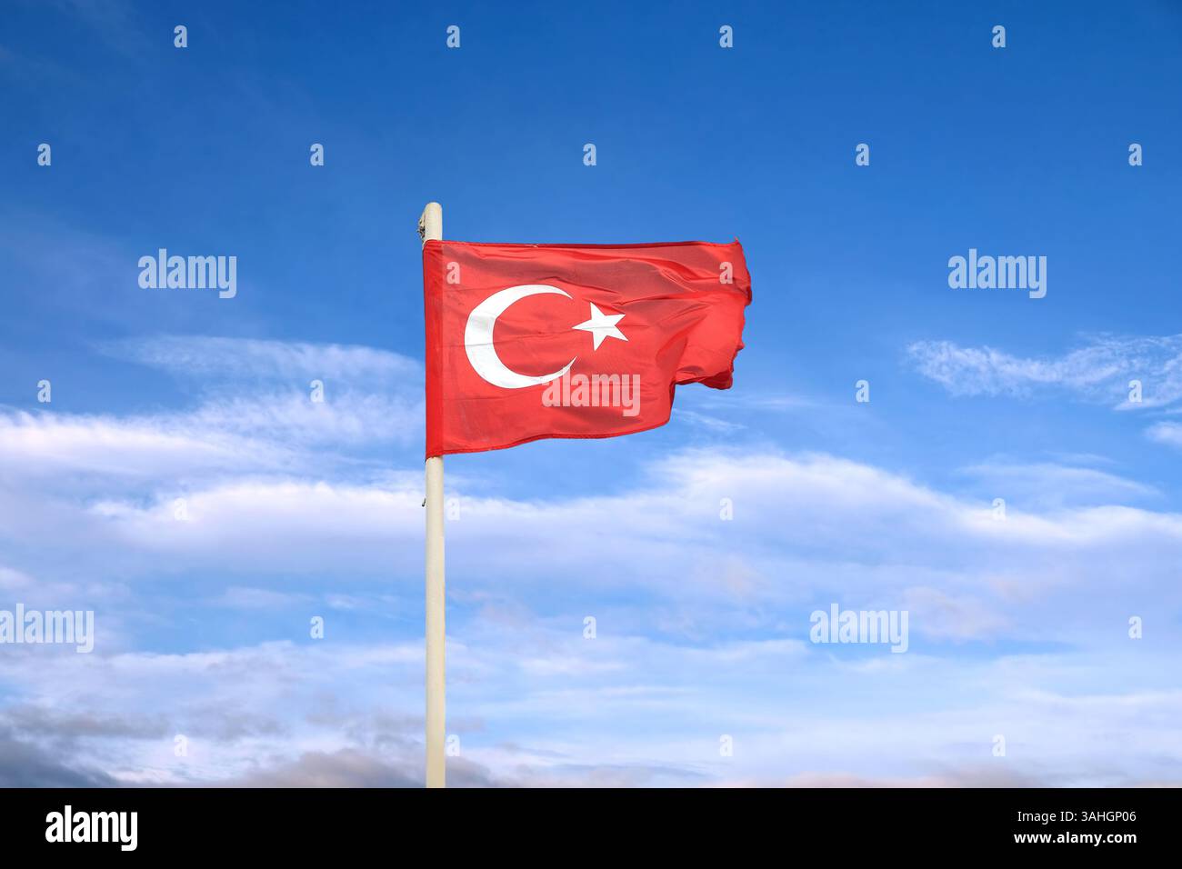 State flag of Turkey with star and crescent waving on flagpole in sunny ...