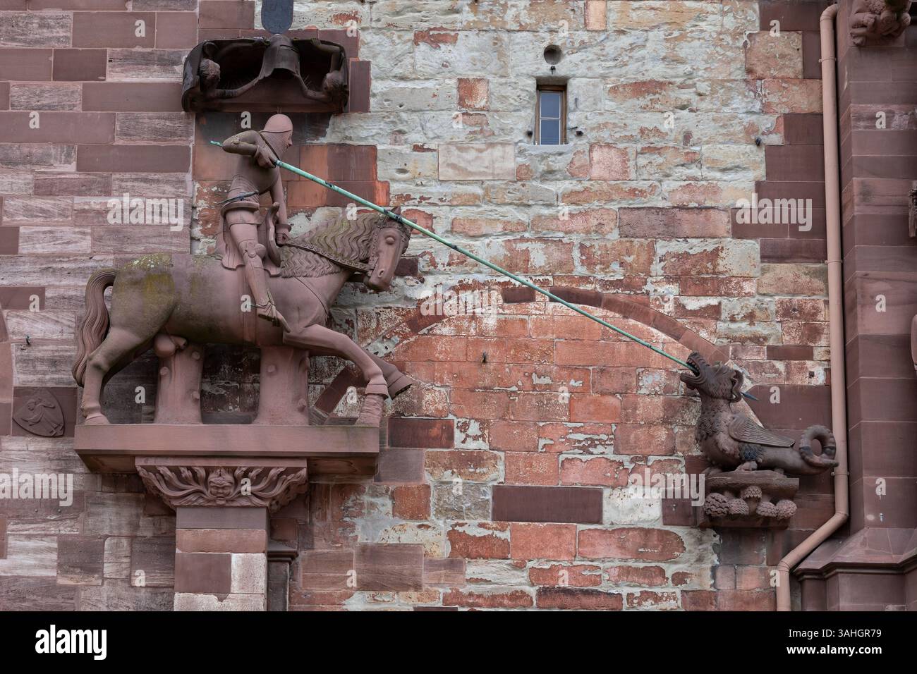 Equestrian statue of St. George slaying the Dragon on tower facade of ...