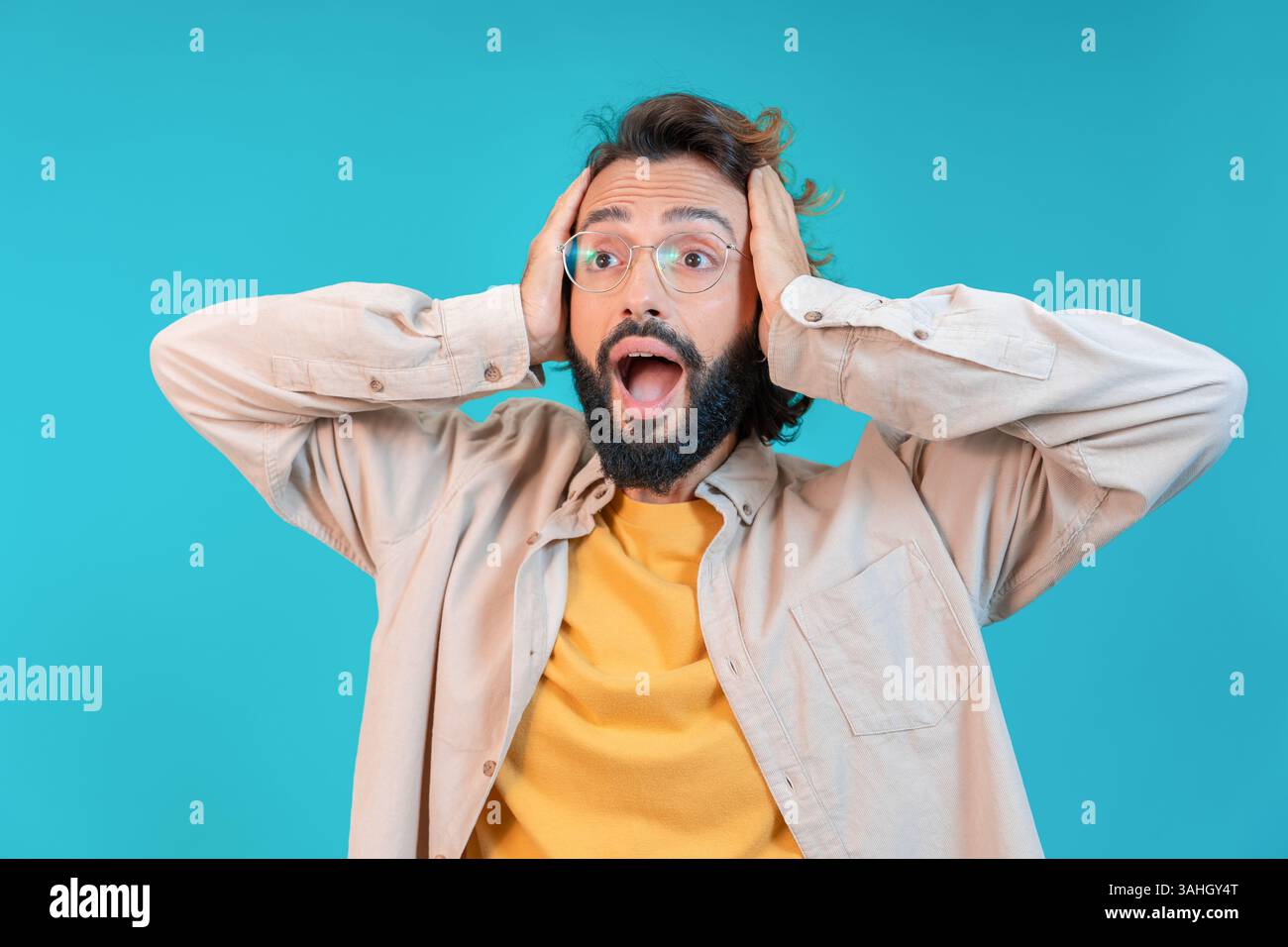 Surprised Man Expressing Shock and Disbelief with His Hands Raised on ...